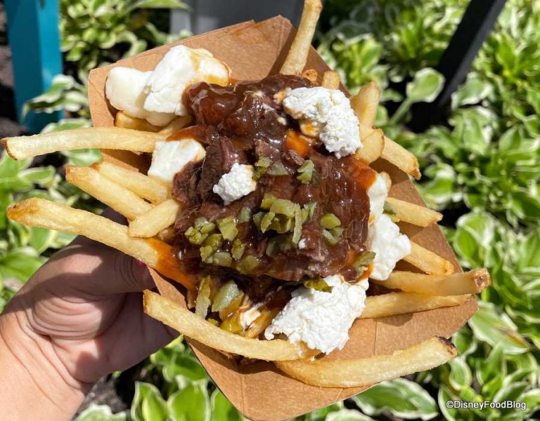 REVIEW: EPCOT's New Poutine Comes With EXTRA Cheese Sauce And We Aren't ...